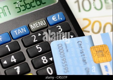 Tan generator and cash card, online banking Stock Photo - Alamy