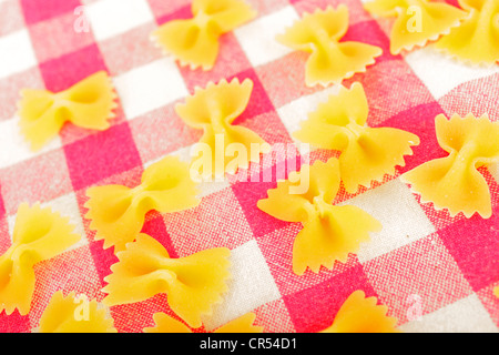 Raw farfalle pasta background Stock Photo - Alamy