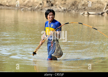 Young man from the indigenous Wichi Indians tribe fishing with a spear ...