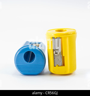 Blue and yellow pencil sharpeners isolated on white, closeup, School ...