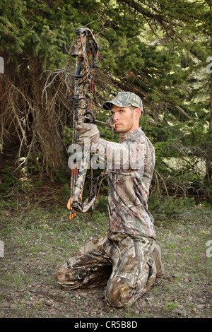 bow-hunter with a modern compound bow Stock Photo - Alamy