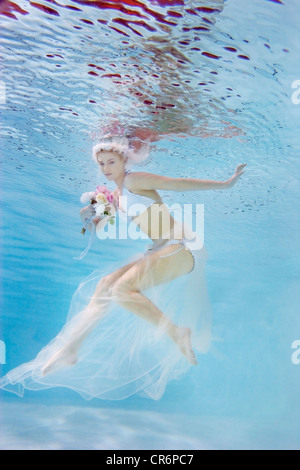 Caucasian bride in bikini swimming under water Stock Photo - Alamy
