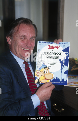 Comic book artist Albert Uderzo poses with his character named Asterix ...
