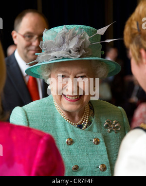 Britain's Queen Elizabeth II visits the set of the long running ...