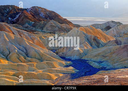 Coloured rock formations at sunset at Zabriskie Point, Death Valley ...