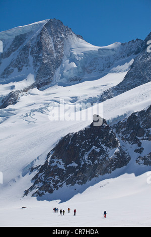 Scenic winter view of ski touring tracks on the snow-covered slopes of ...