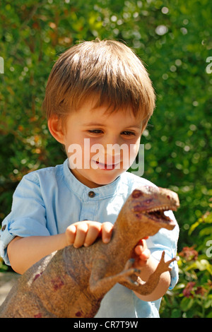 Little boy and Tirannosaurus rex Stock Photo - Alamy