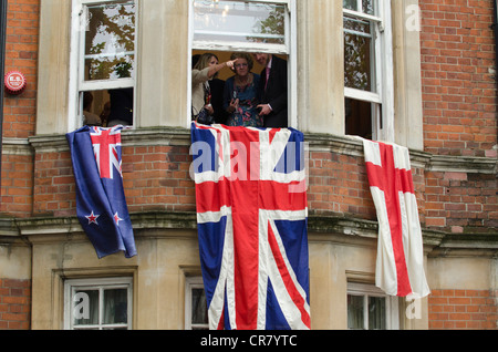 A Union Jack hanging from a window in a block of flats Stock Photo ...