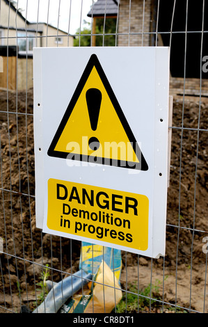 Demolition warning sign on site fencing, social housing property Stock ...