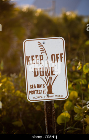 Sand dunes with warning sign. Environmental protection. Wide shot Stock ...