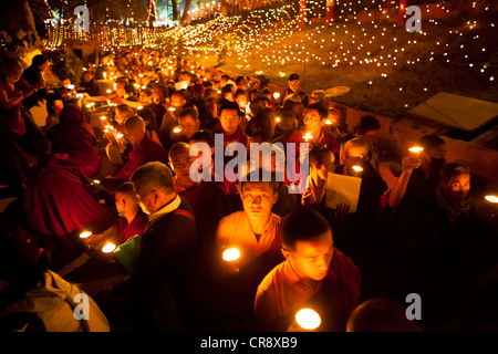 Buddhist monks and pilgrims pray with oil lamp at night , Mahabodhi ...