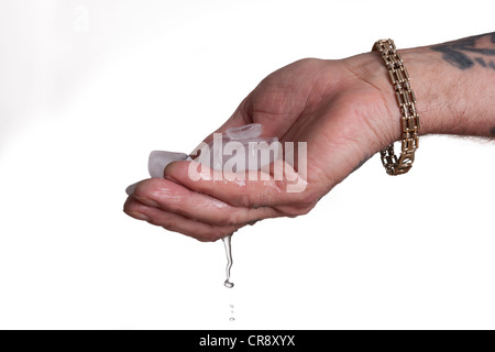 Hand Holding Melting Ice Cubes Stock Photo - Alamy