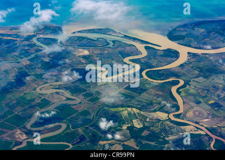 Aerial view of river flowing through small town in valley Stock Photo ...