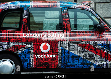 black london cab taxi with union flag advertising on westminster bridge ...
