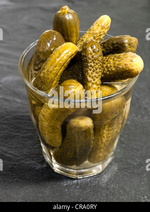 Pickled Gherkins or Cornichons in Glass with Cocktail Sticks Stock ...