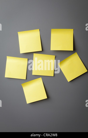 Stationery with sticky notes on grey background. April Fool's Day prank ...