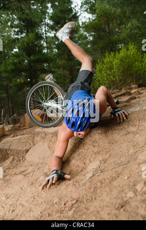 Mountain Biker Falling off his bike Stock Photo - Alamy