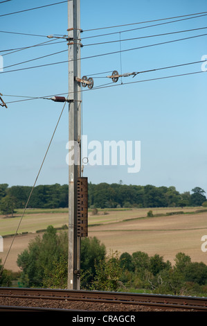 Overhead lines, catenary and tension weights c1998 Stock Photo - Alamy