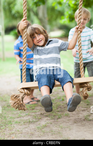 Young boy pushing a friend on the stairs in school corridor Stock Photo ...