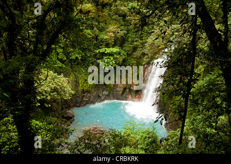 Waterfall with the blue waters of the Rio Celeste in Volcán Tenorio ...