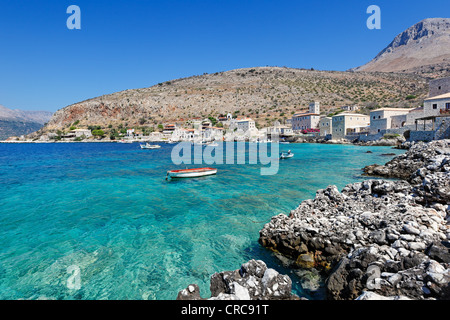 Limeni village in Mani, Peloponnese, Greece. People swimming in ...