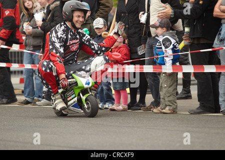 Motorcycle stuntman Mike Auffenberg riding a pocket bike, Koblenz ...