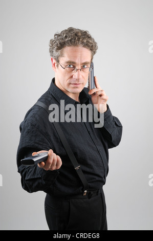 Using Two Cell Phones at same time Stock Photo - Alamy