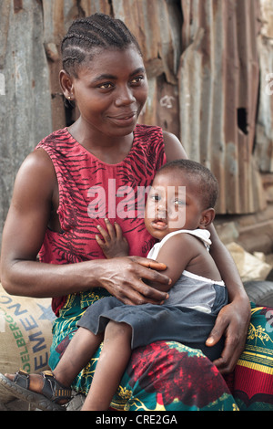 West Africa,Liberia. Young woman of Kpelle ethnic group weaving a bag ...