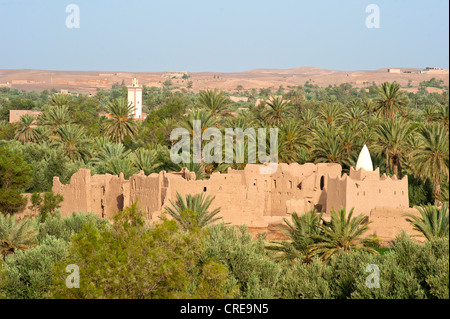 Marabout or tomb of an Islamic saint, and crumbling adobe houses in a ...