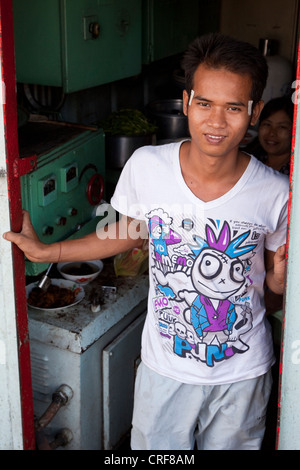 Myanmar, Burma. Burmese Man Wearing a Longyi, the Burmese Wrap-around Sarong, and Sandals. Inle ...