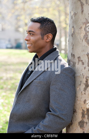 Young handsome African businessman against colored background Stock ...