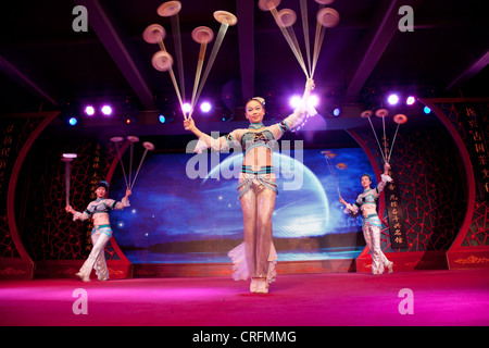 Acrobats perform a plate spinning routine in stage at Laoshe teahouse ...