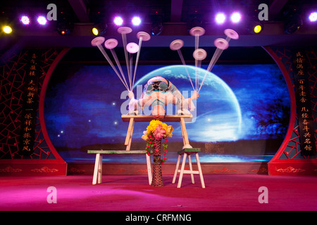 Acrobats perform a plate spinning routine in stage at Laoshe teahouse ...