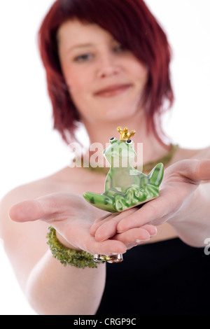 Charming woman is stretched out in a dance studio near the mirror. The ...