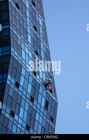 Window washer on side of skyscraper Stock Photo - Alamy
