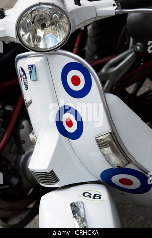 A Vespa scooter with Mod stickers Stock Photo - Alamy