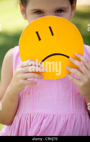 sad girl hiding face behind mask Stock Photo: 95560473 - Alamy