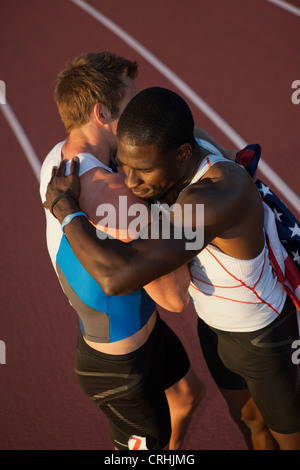 High angle shot of age-diverse boys and girls jumping on the trampoline ...