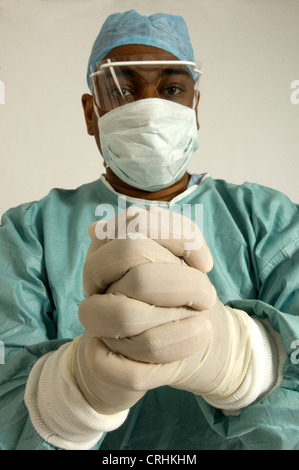 Portrait of surgeon holding out his clasped hands Stock Photo - Alamy