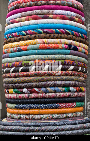 A towering baobab tree made from colorful strands of recycled textiles ...