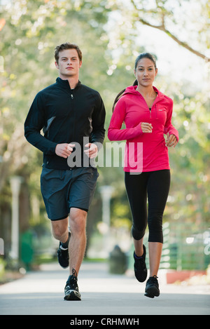 Young couples outdoor jogging Stock Photo - Alamy
