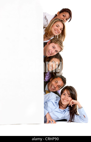 young man peering behind a white sign Stock Photo - Alamy