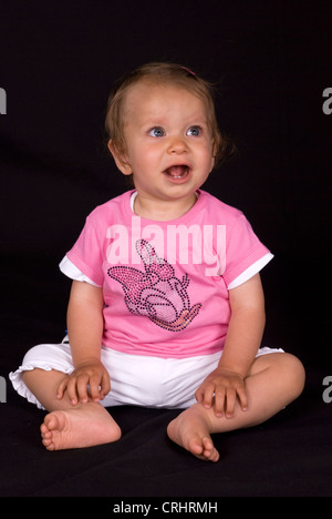 Baby squatting in diapers Stock Photo - Alamy