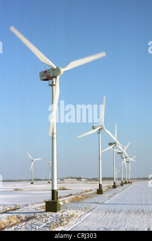 Pewsum, wind wheels in snow-covered landscape of East Frisian Stock ...