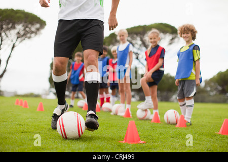 Football coach coaching children. Soccer football training session for ...
