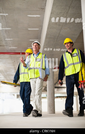 Workers walking at construction site Stock Photo: 48976308 - Alamy