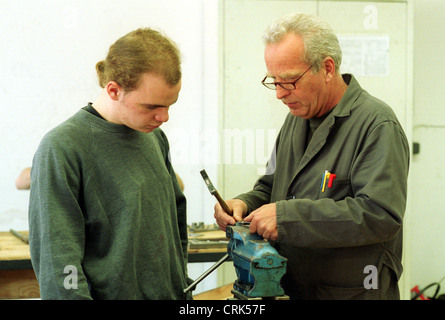 Berlin, an apprentice metal worker is instructed by his master Stock ...