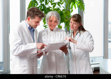 Doctors speaking together Stock Photo - Alamy