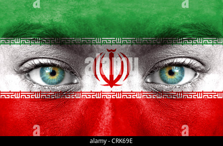 Human face painted with flag of Iran Stock Photo - Alamy