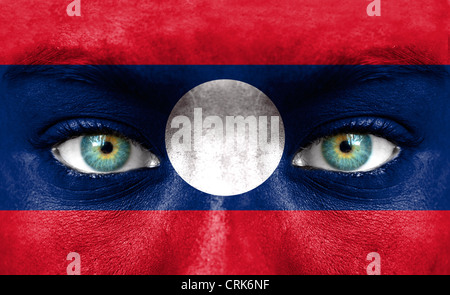 Human face painted with flag of Laos Stock Photo - Alamy